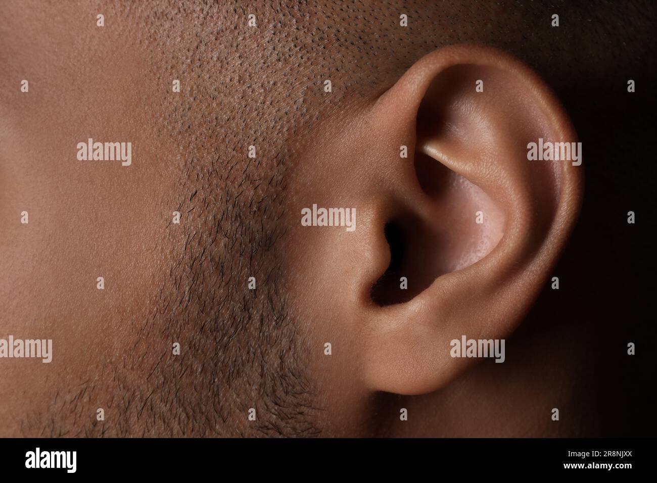 Ear view of healthy young man hi-res stock photography and images - Alamy