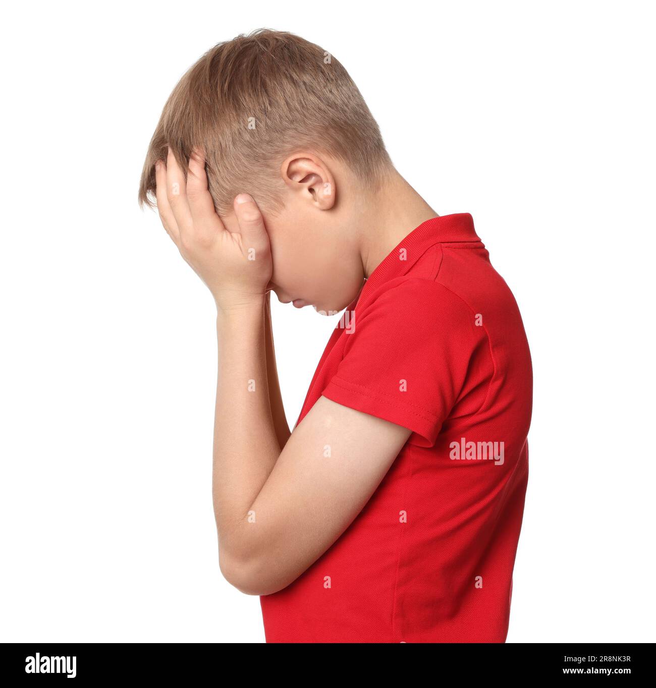 Boy covering face with hands on white background. Children's bullying ...