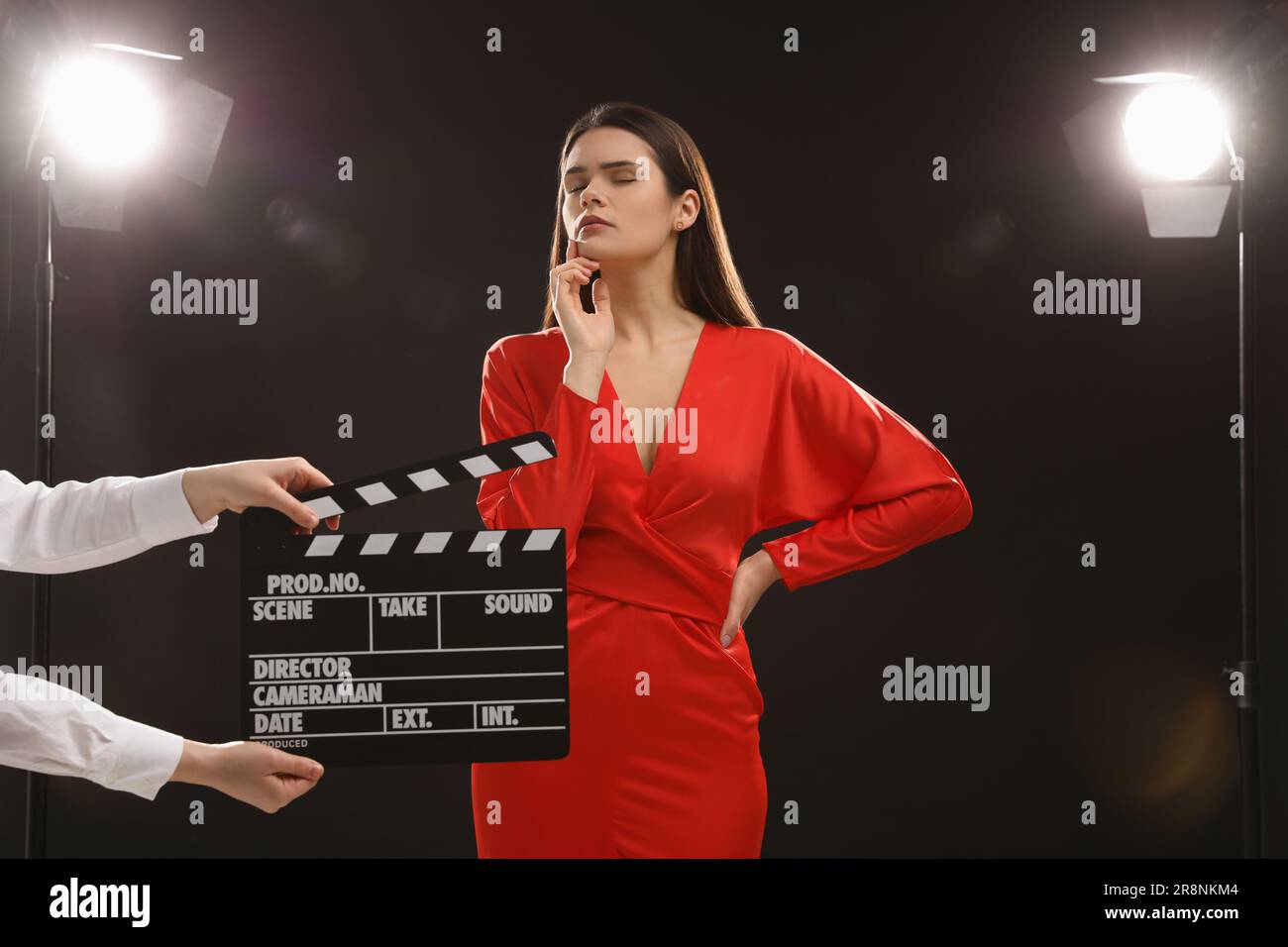 Emotional actress performing while second assistant camera holding ...