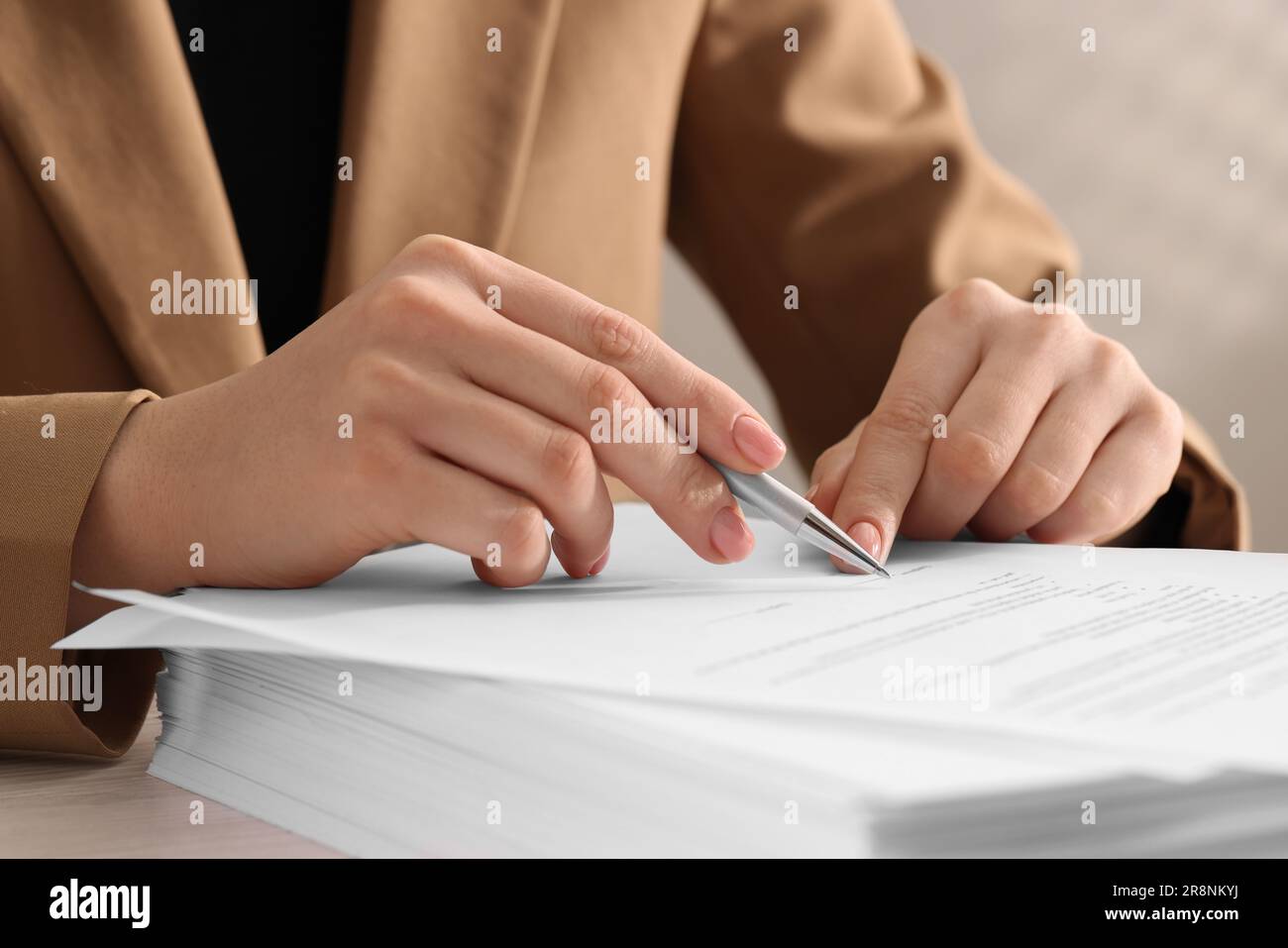 Woman signing document at table, closeup view Stock Photo - Alamy