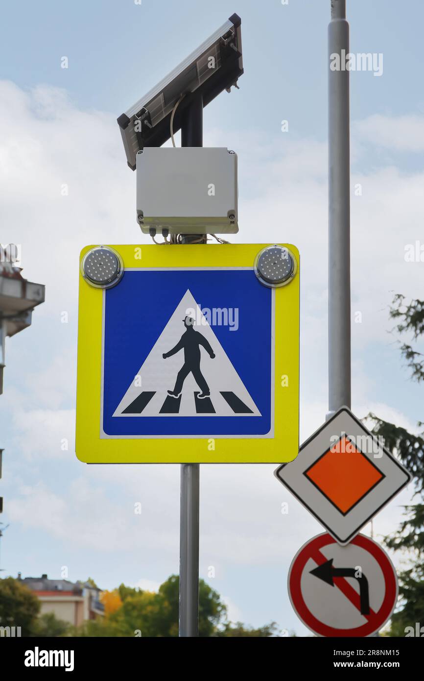 Traffic sign Pedestrian Crossing and Main road against sky outdoors ...