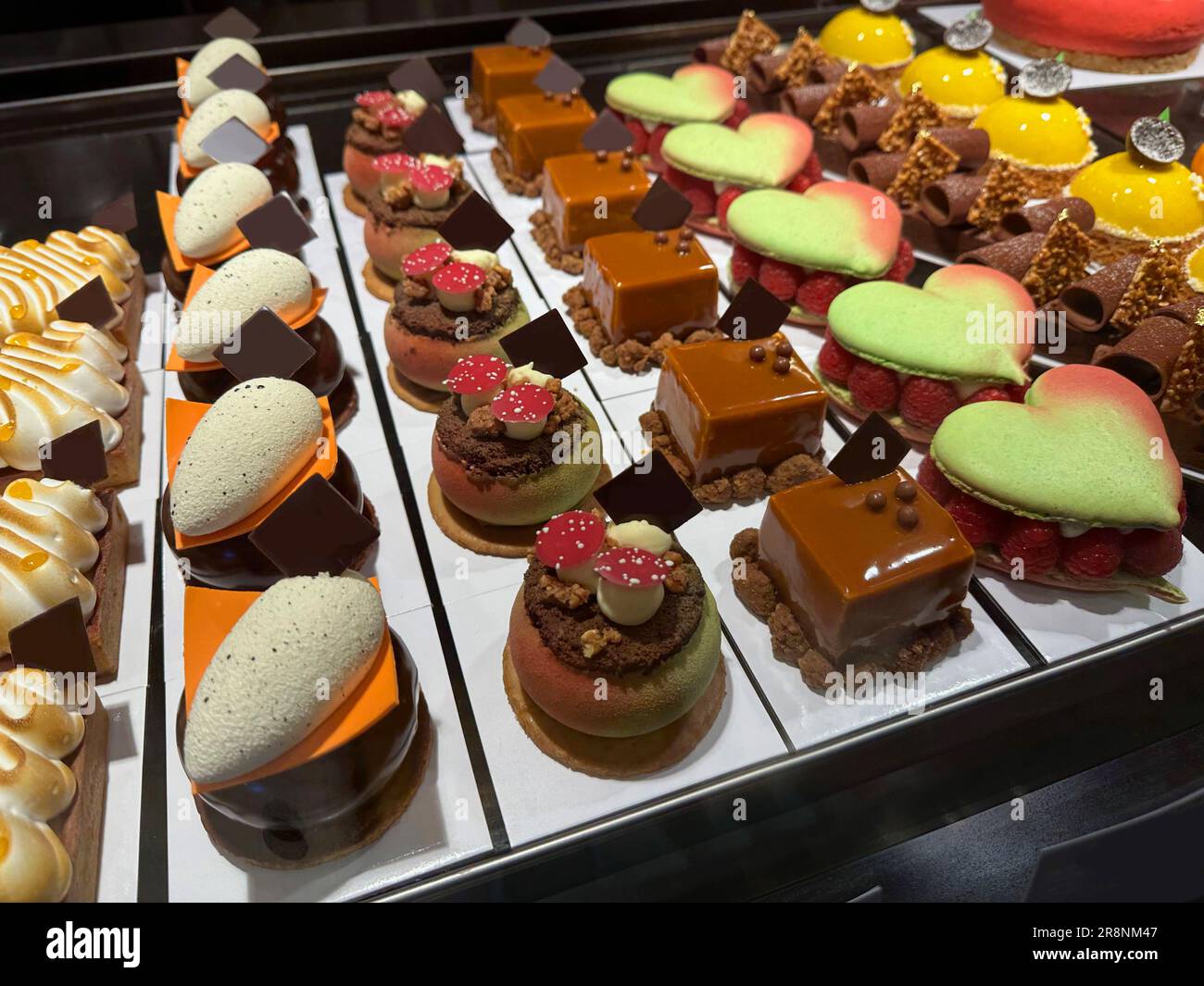 Showcase with different tasty desserts in store Stock Photo - Alamy