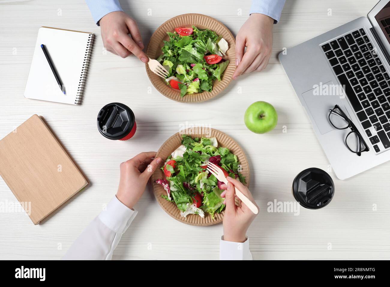 Office employees having business lunch at workplace, top view Stock ...