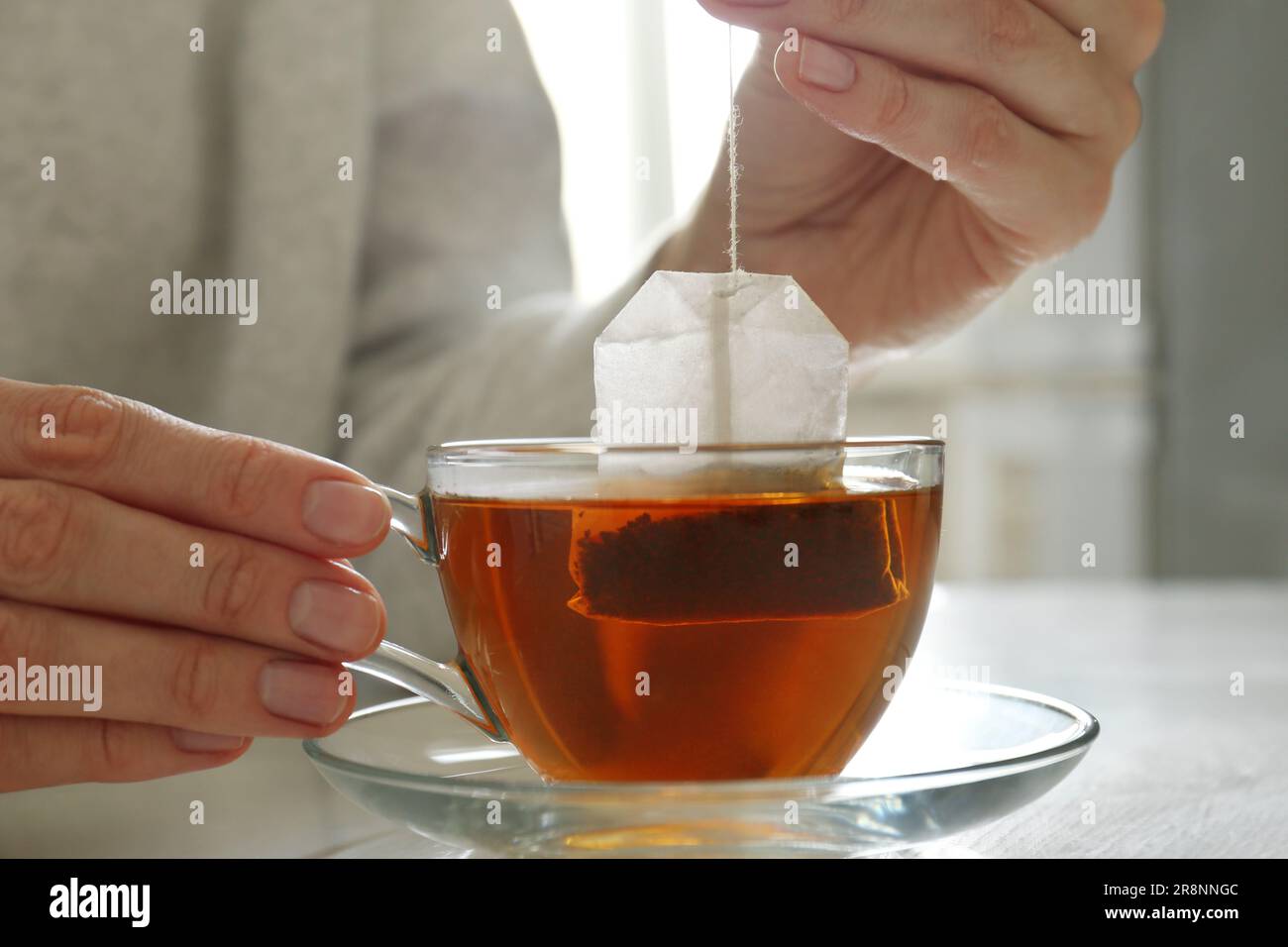 Woman taking tea bag hi-res stock photography and images - Alamy
