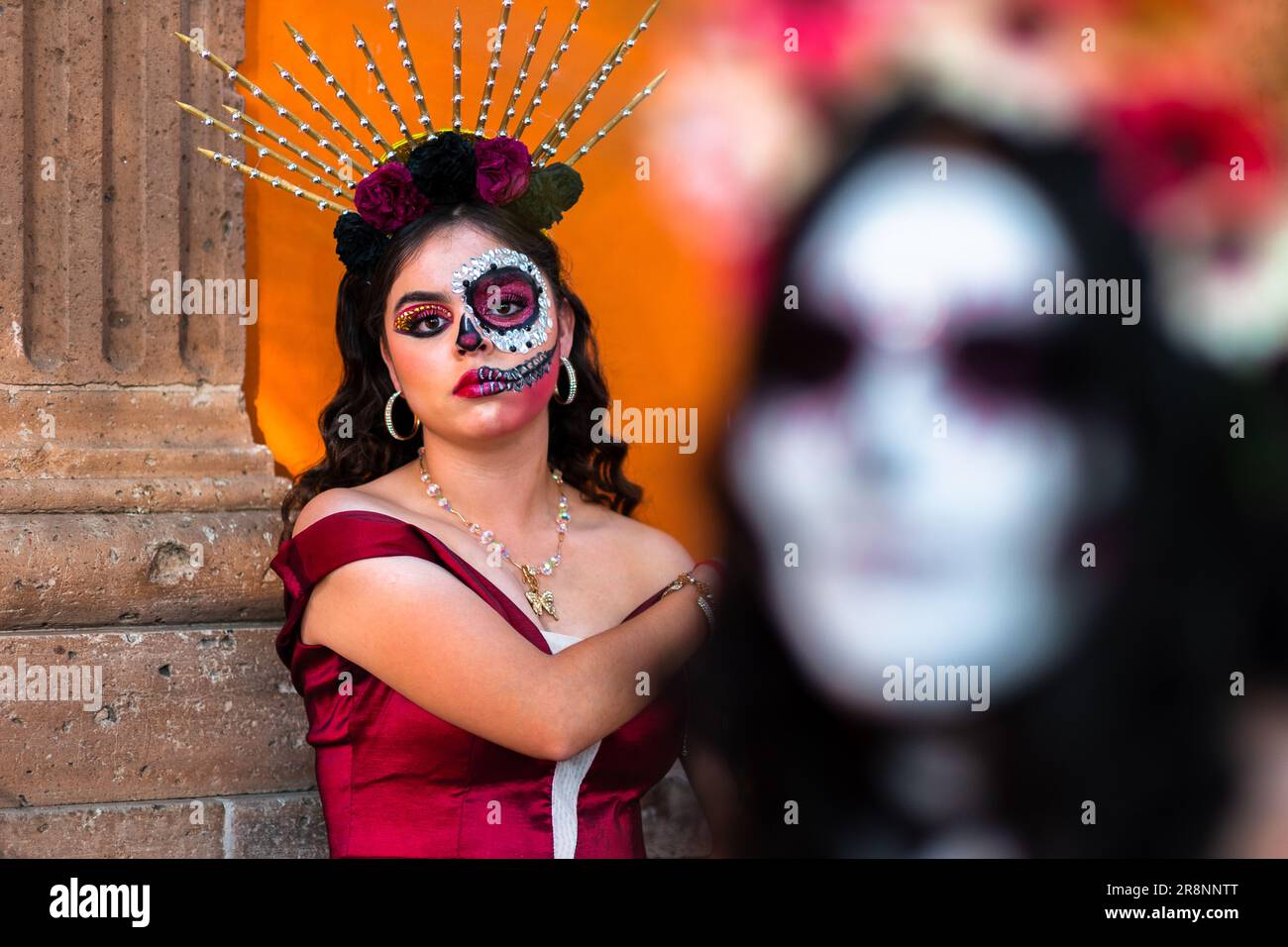 A young Mexican woman, dressed as La Catrina, takes part in the Day of ...