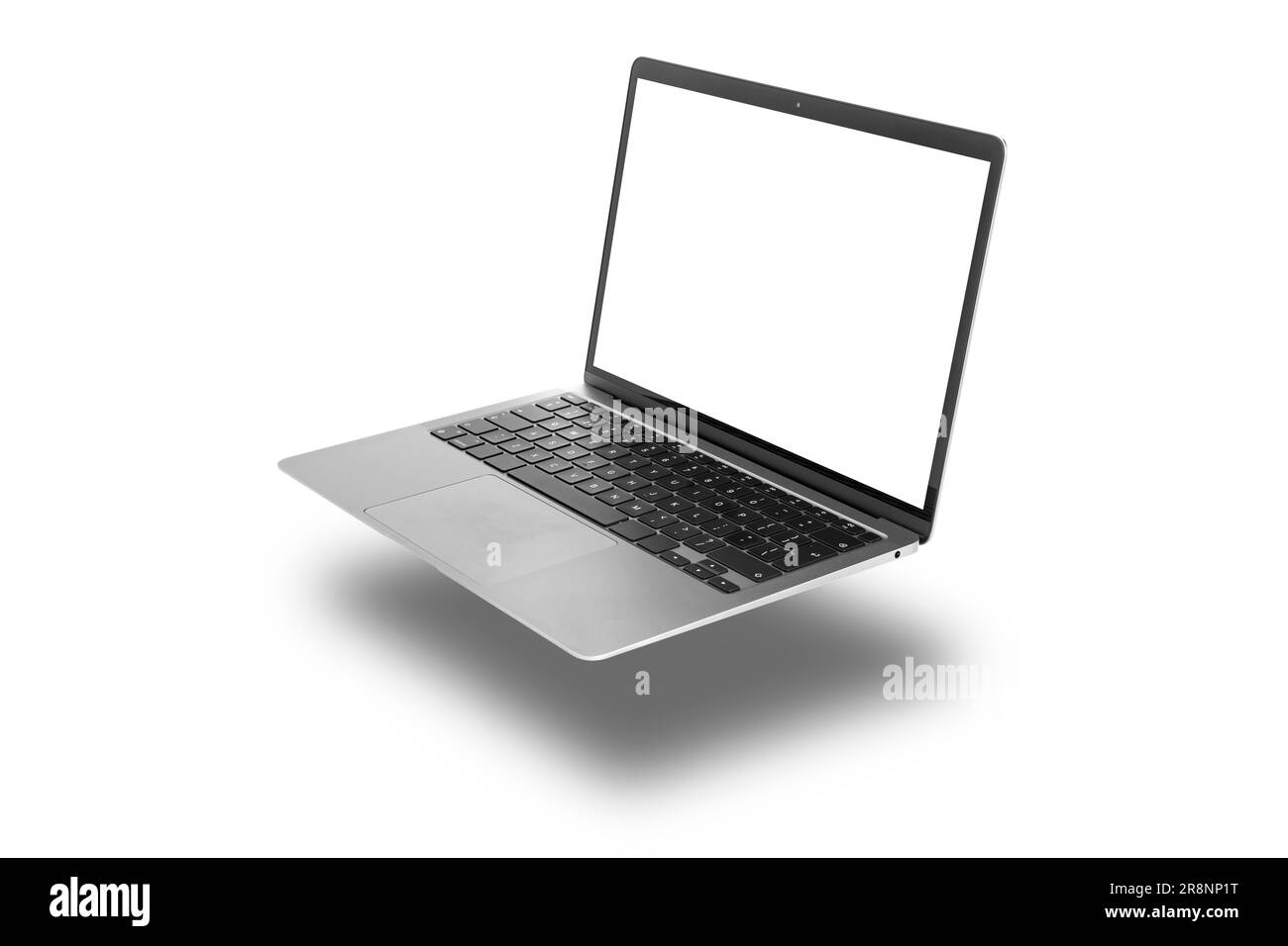 One modern laptop flying on white background Stock Photo - Alamy