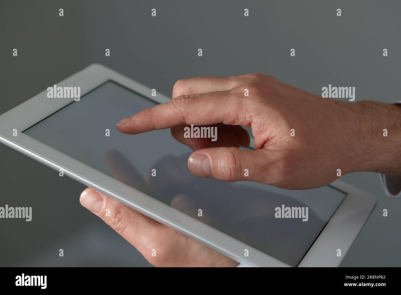 Closeup view of man using new tablet indoors Stock Photo - Alamy