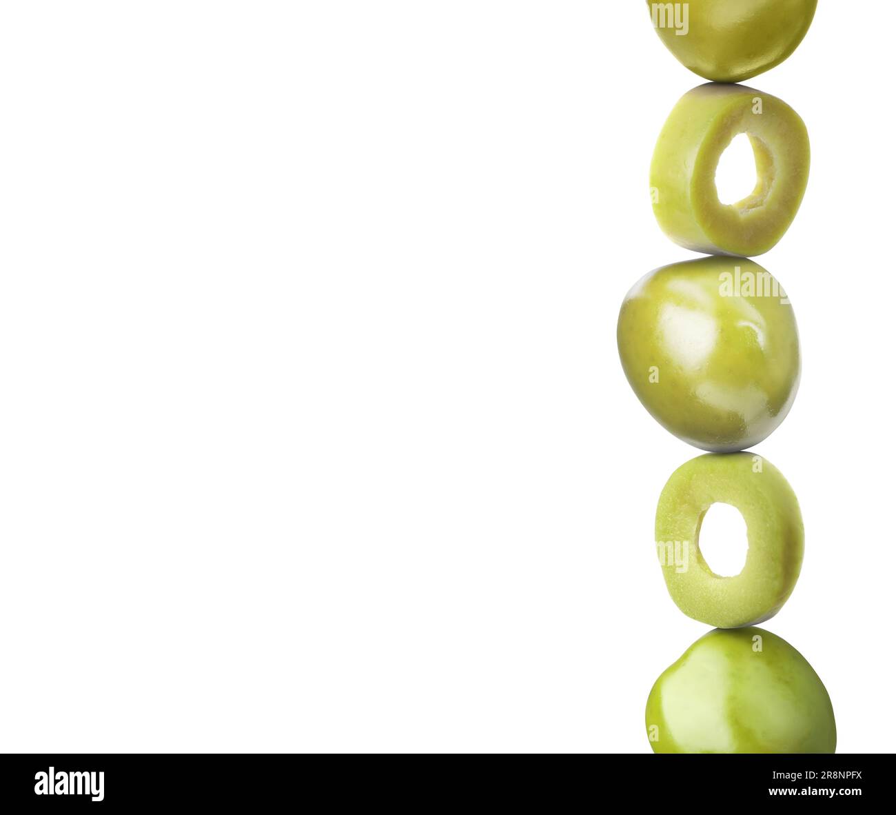 Cut and whole green olives on white background Stock Photo - Alamy