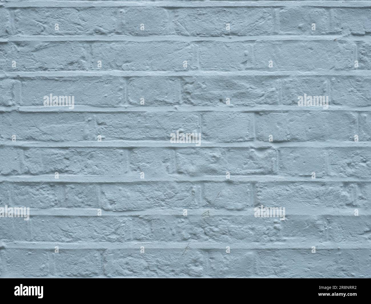 light blue brick wall useful as a background Stock Photo - Alamy