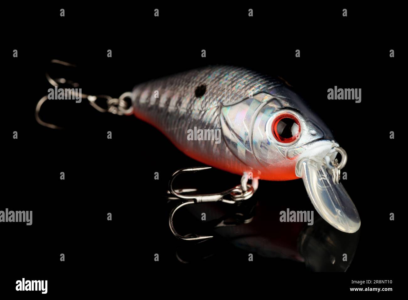 Plastic fishing lure - rattler crank isolated on black background Stock ...