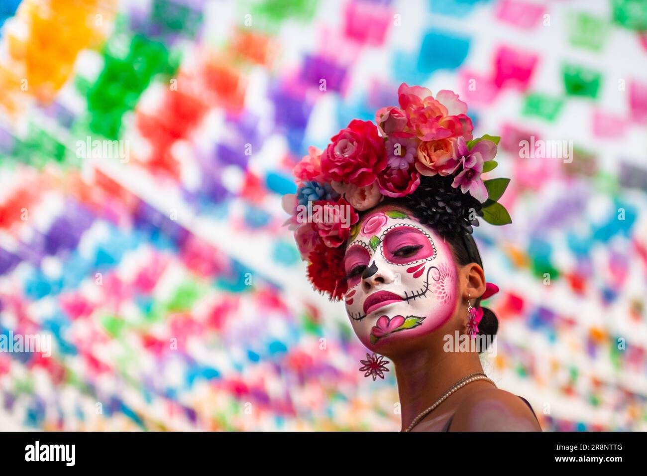 A young Mexican woman, dressed as La Catrina, takes part in the Day of ...