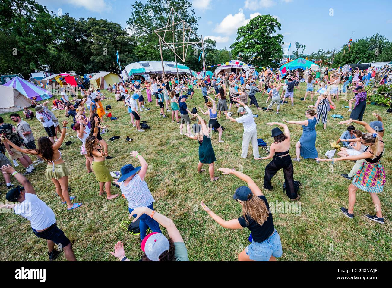 Glastonbury, UK. 22nd June, 2023. A large outdoor yoga class - The ...