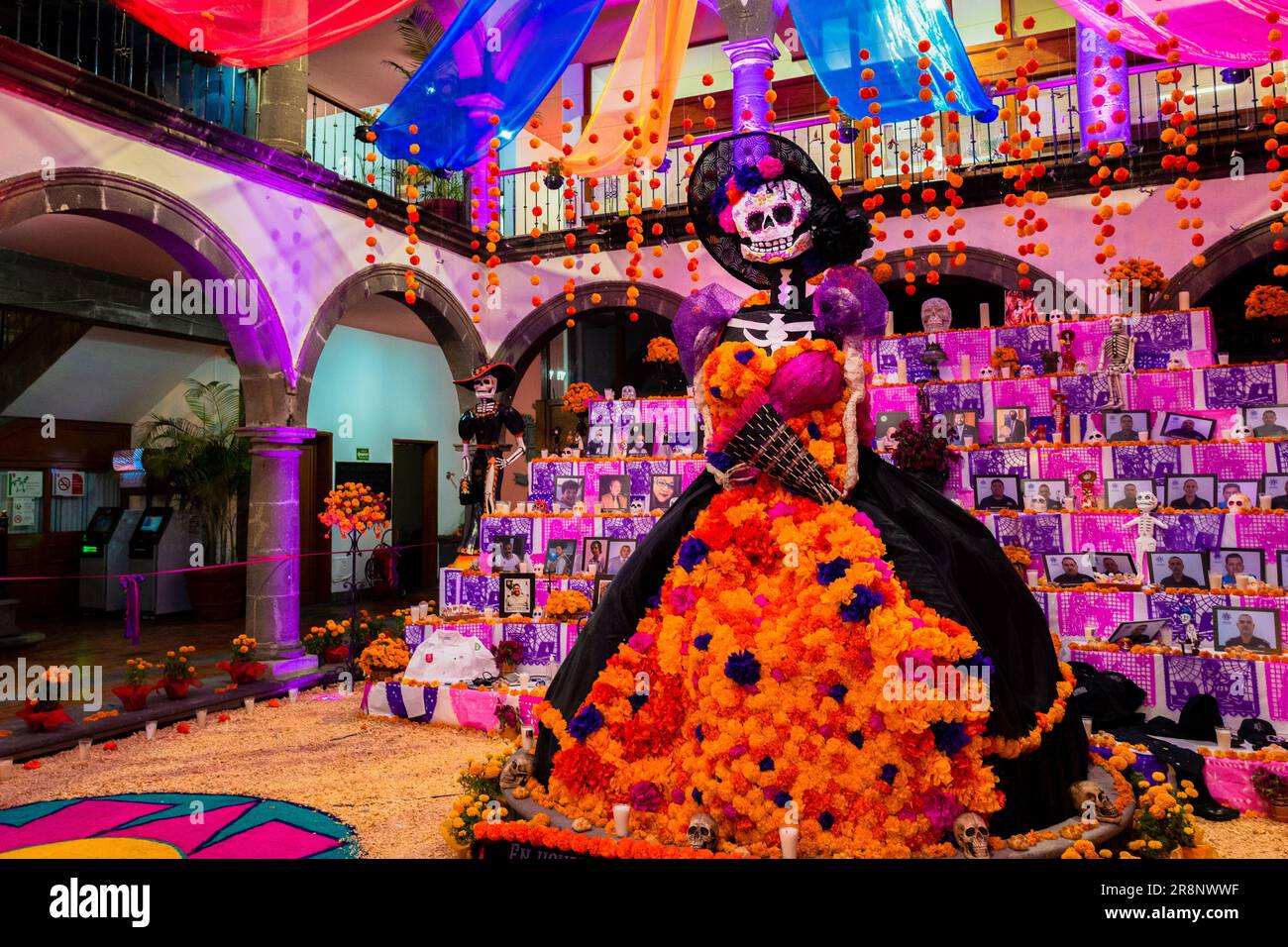La Catrina figure is placed in front of the altar of the dead (Altar de ...