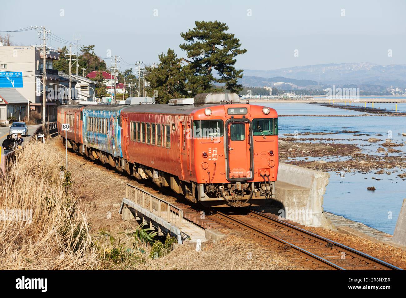 Train of Himi line running along Amaharashi coast Stock Photo - Alamy