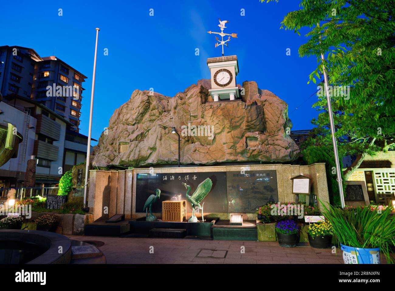 the night view of the clock tower in Yumoto Square Stock Photo - Alamy