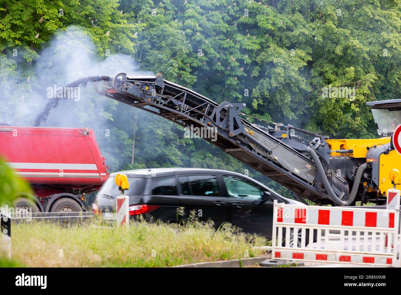 Asphalt milling and grinding machine at road repair and construction ...