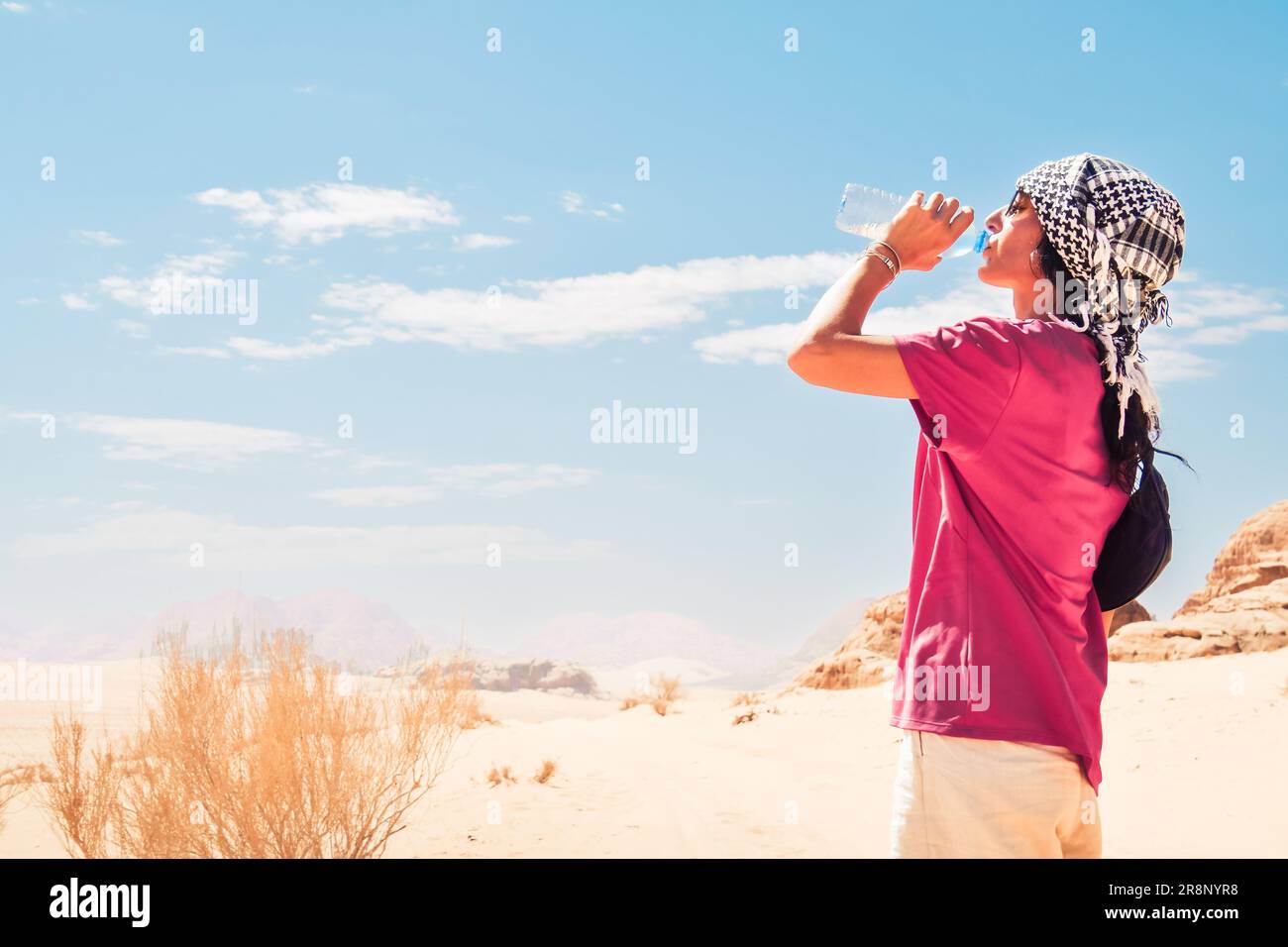Thirsty desert traveler young caucasian woman with face red of sun burn ...