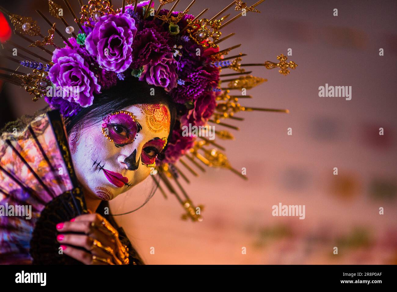A young Mexican woman, dressed as La Catrina, takes part in the Day of ...