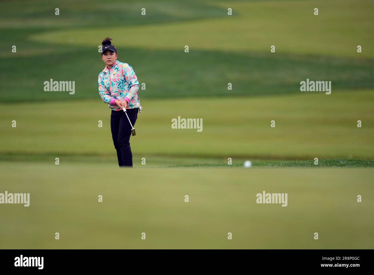Lucy Li watches her putt on the 15th hole during the first round of the ...