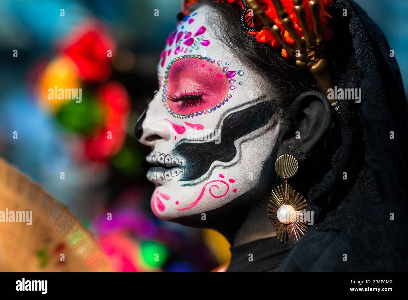 A young Mexican woman, dressed as La Catrina, takes part in the Day of ...