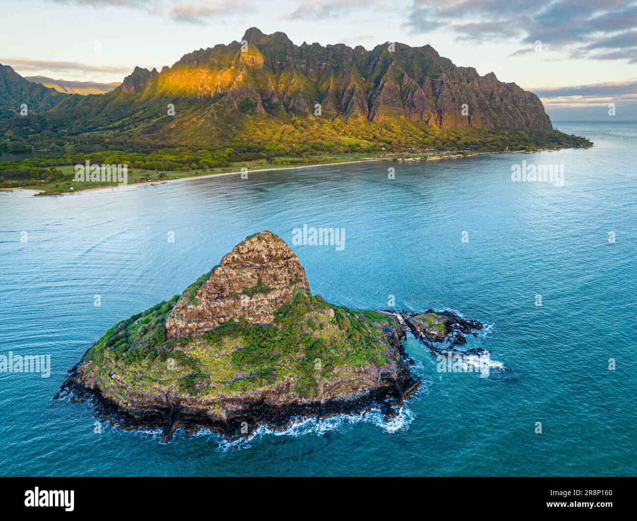 A scenic view of a tropical island surrounded by a crystal-clear body ...