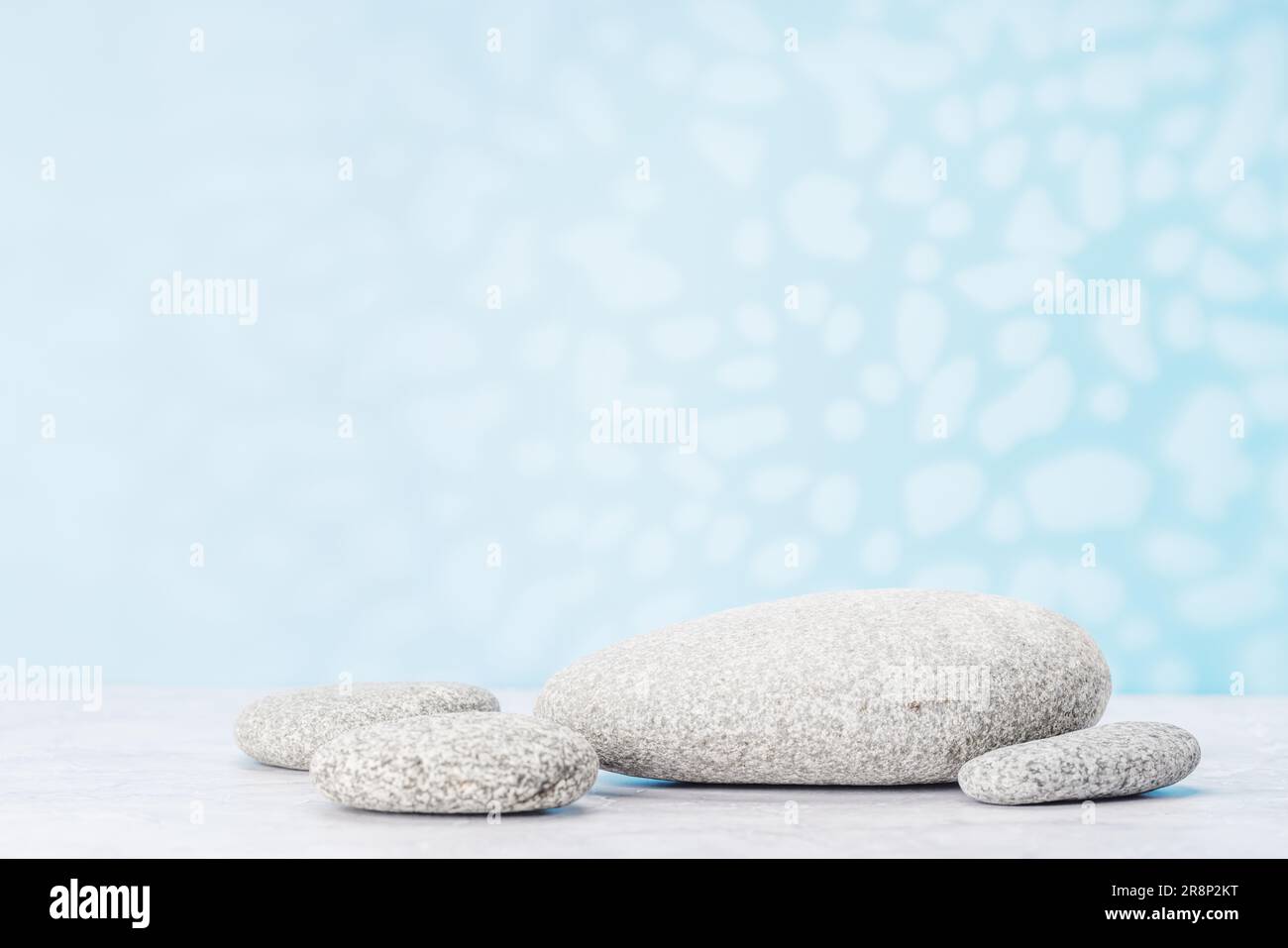 A visually appealing backdrop with smooth sea pebbles and ample copy ...