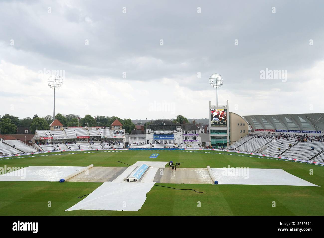 A view of the rain covers on the wicket as rain stops play during day ...