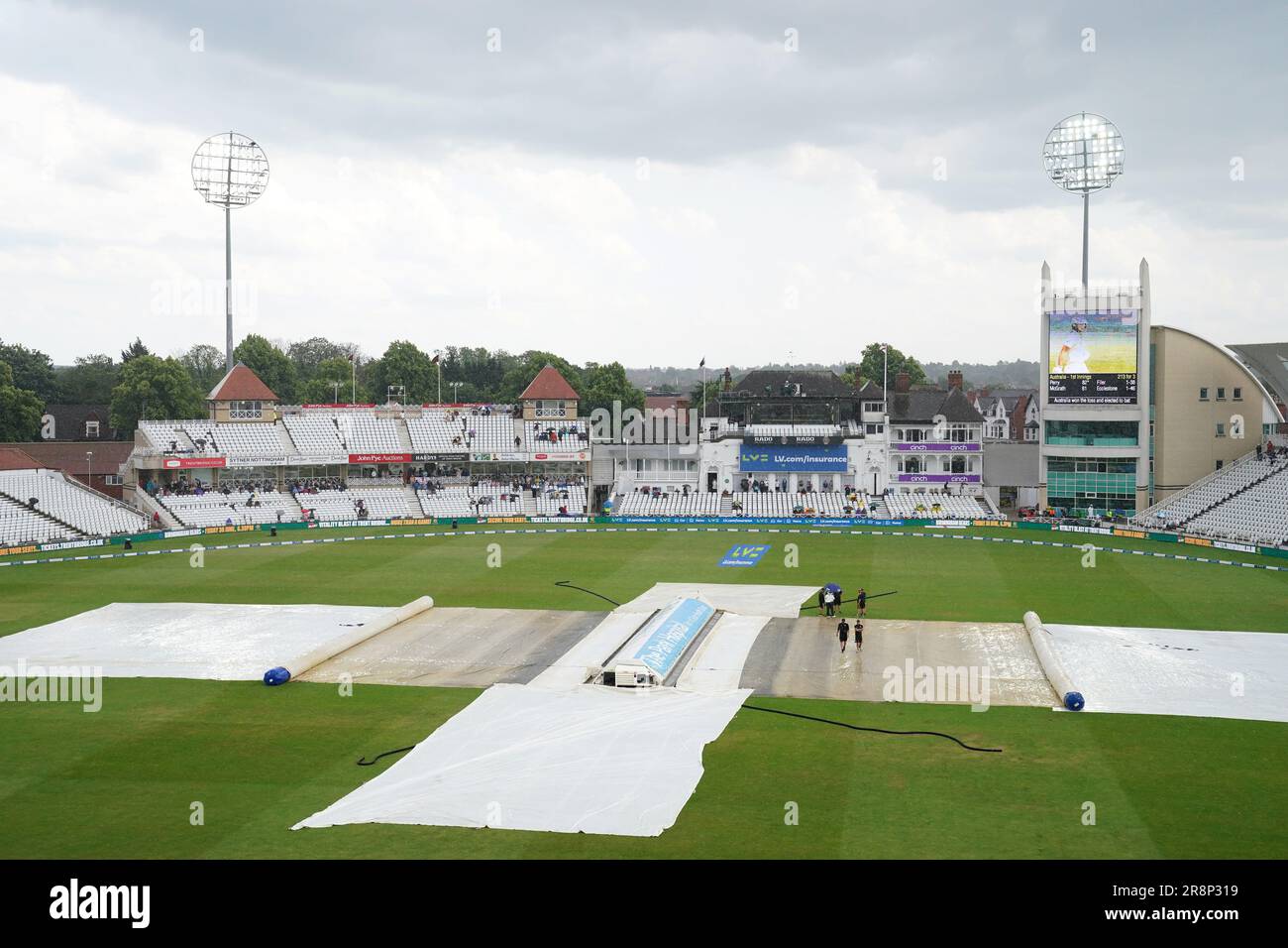 A view of the rain covers on the wicket as rain stops play during day ...