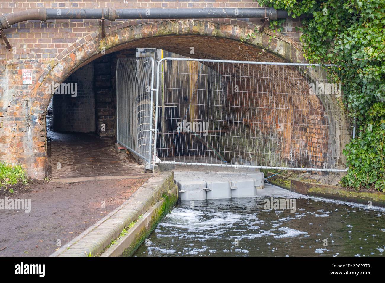 Floating work platform in a canal at a lock siting under a bridge Stock ...