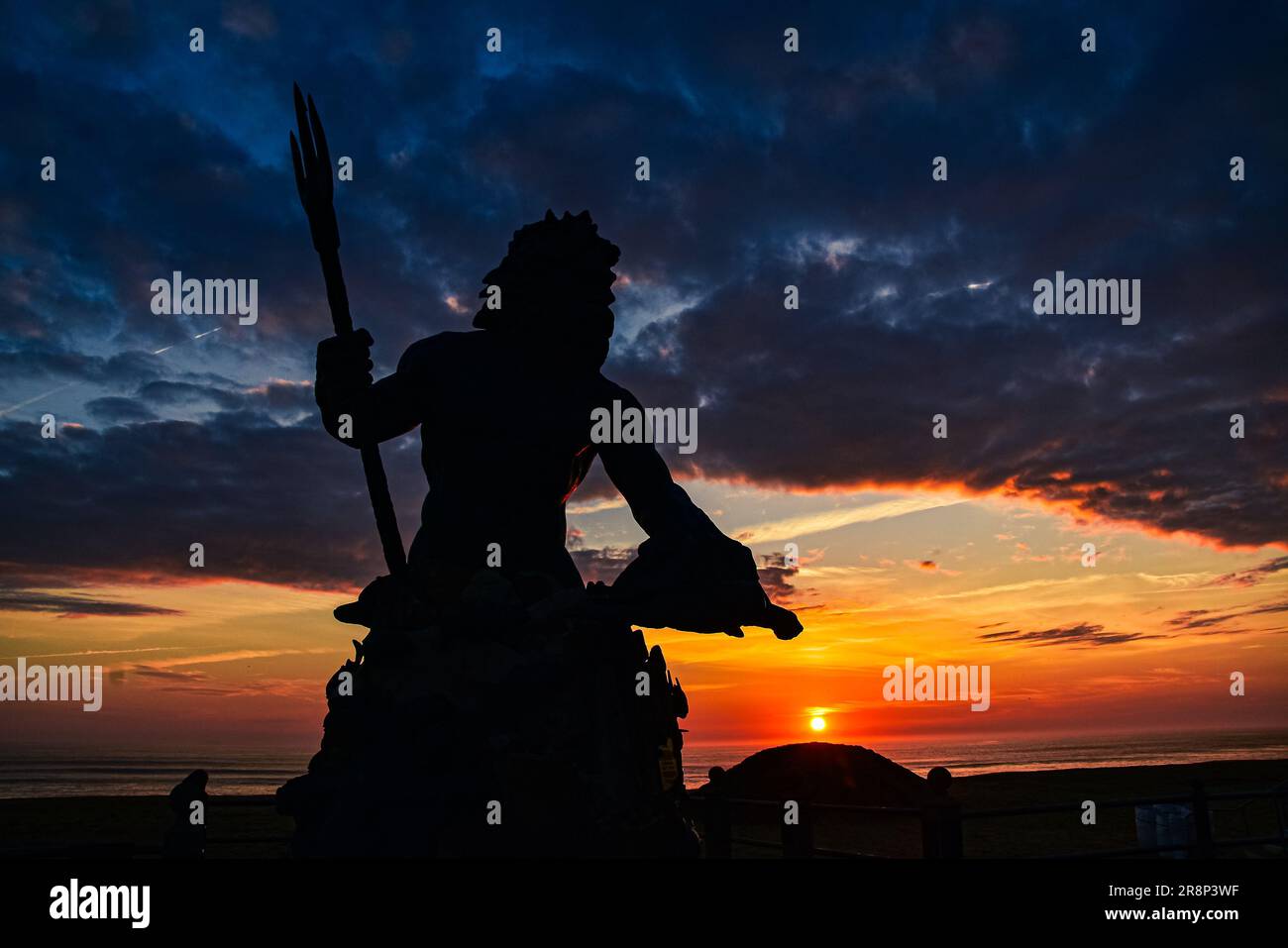 Aerial view of the iconic King Neptune statue silhouette against a ...
