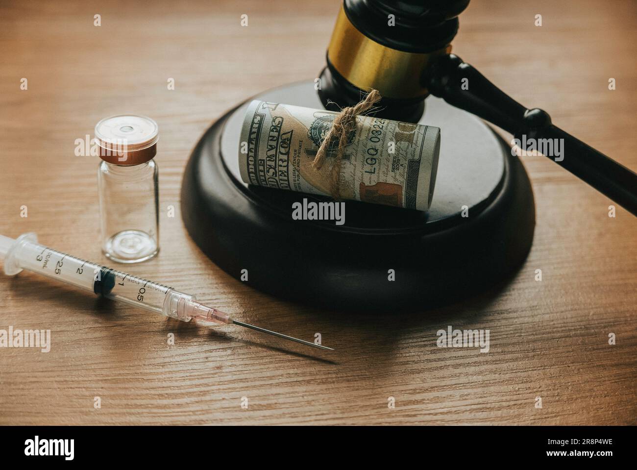 Selective focus of syringe,vaccine,gavel and cash money Stock Photo - Alamy