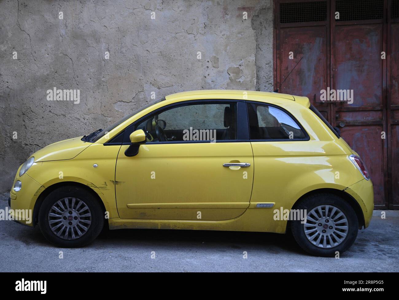 Yellow Fiat 500 on the streets of Agrigento in Sicily, Italy Stock ...