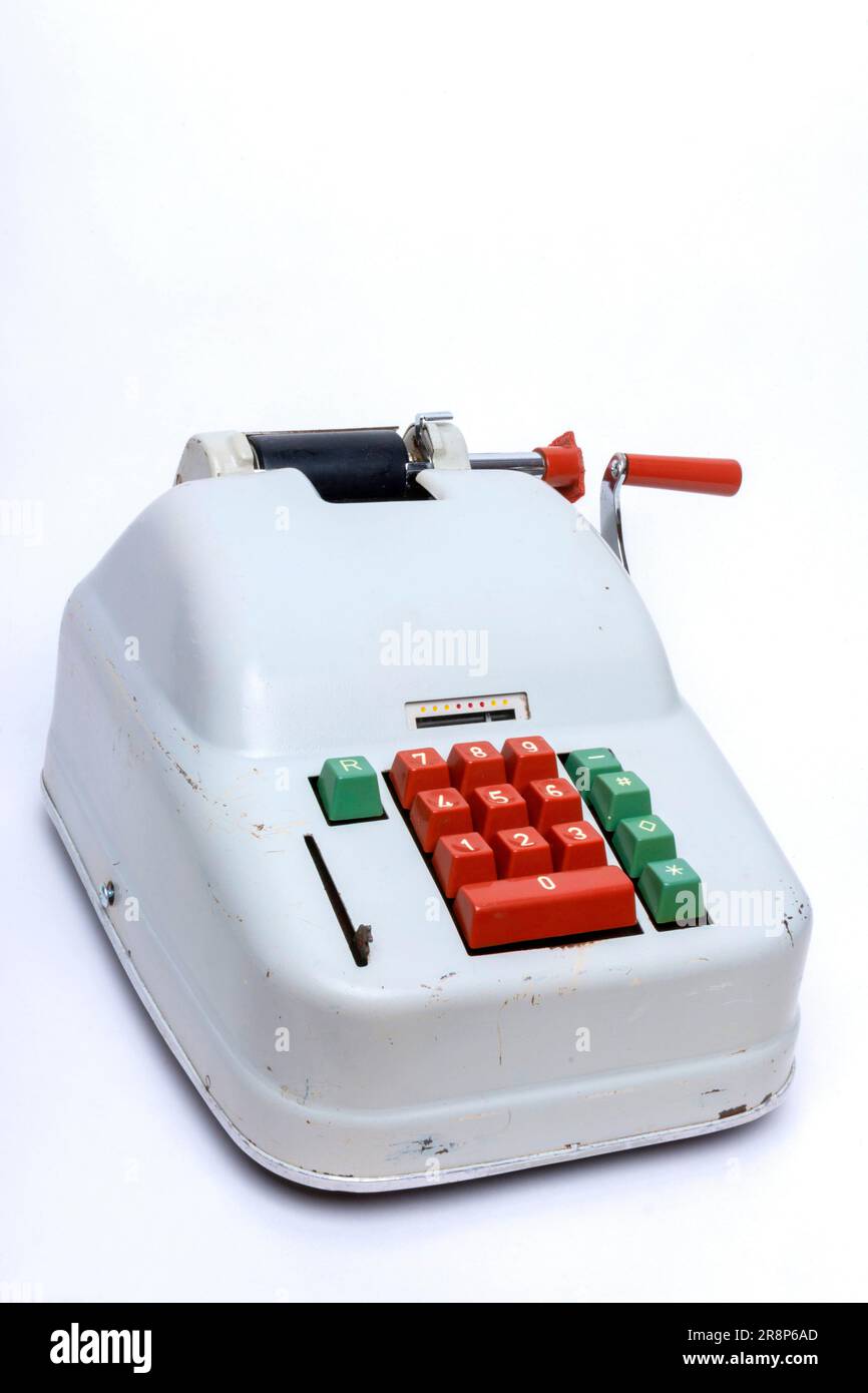 Old calculating machine on white background Stock Photo - Alamy