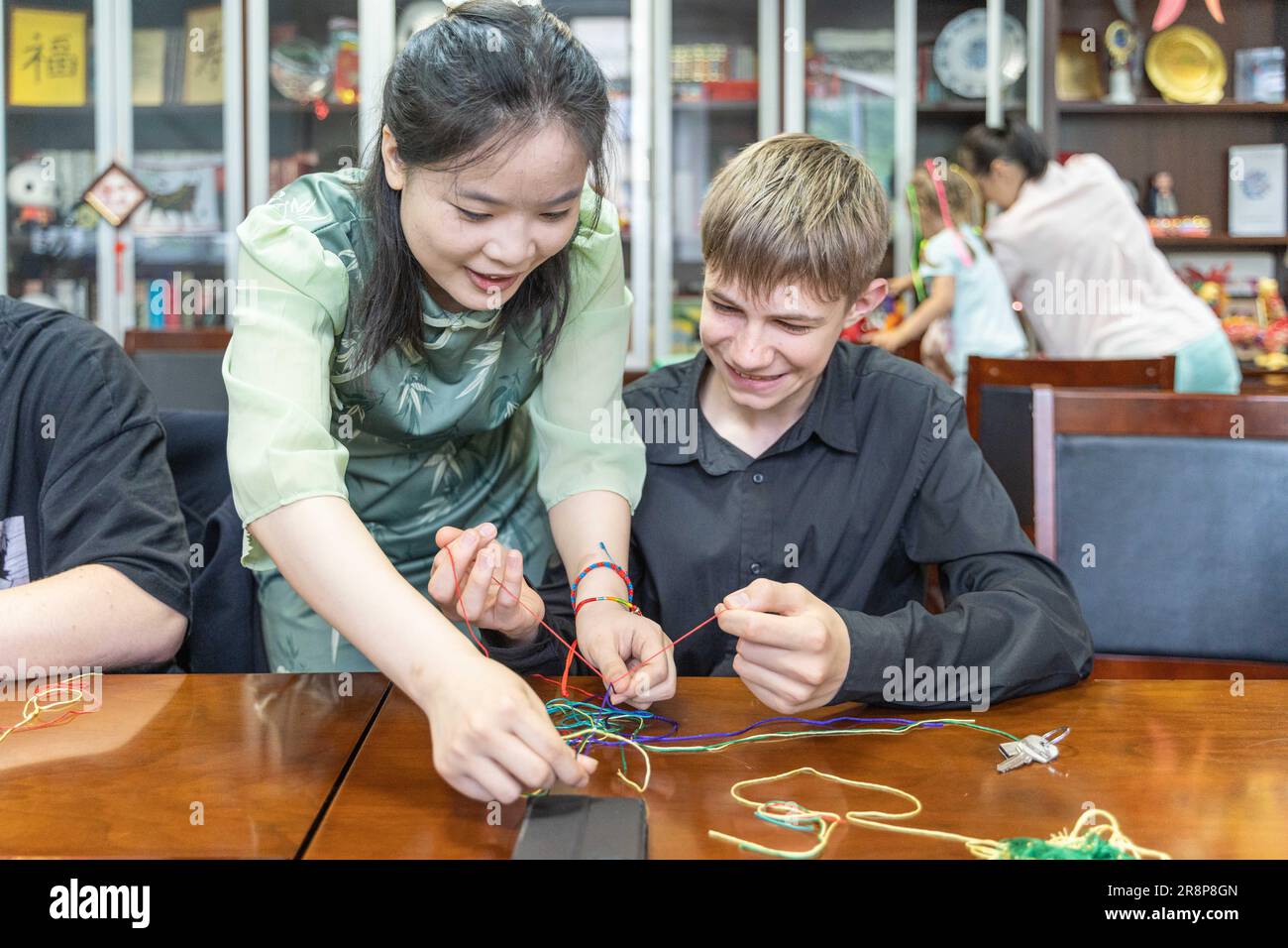 Vladivostok, Russia. 22nd June, 2023. A person learns to weave colorful ...