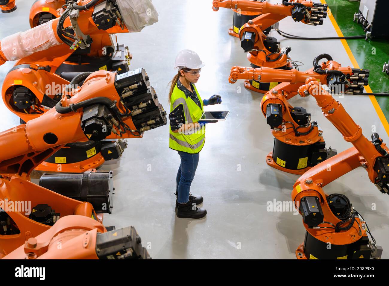 Factory worker managing industrial machine hi-res stock photography and ...