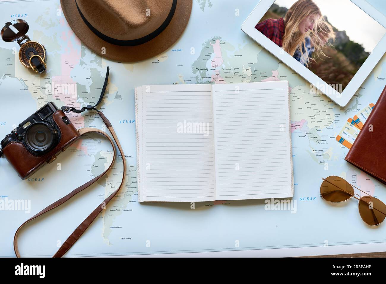 High angle view of open diary with blank sheets on world map Stock ...