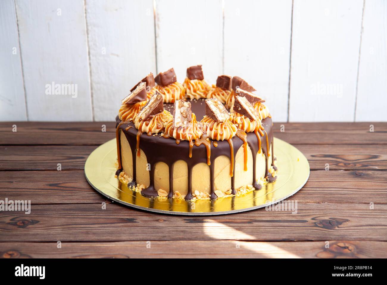 Gorgeous snickers cake with peanut butter cream, melted chocolate ...