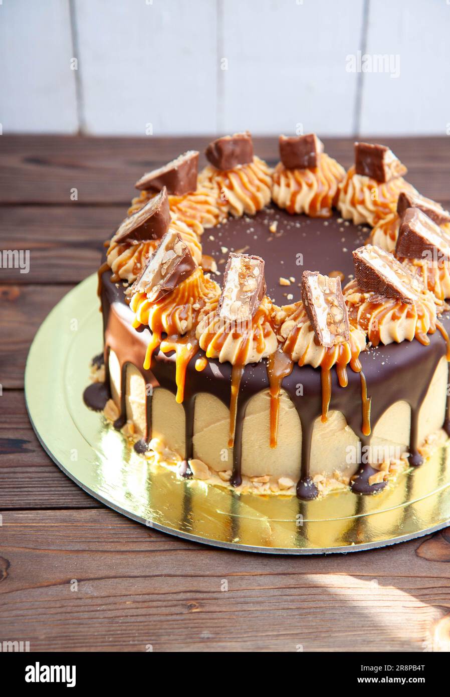 Gorgeous snickers cake with peanut butter cream, melted chocolate ...