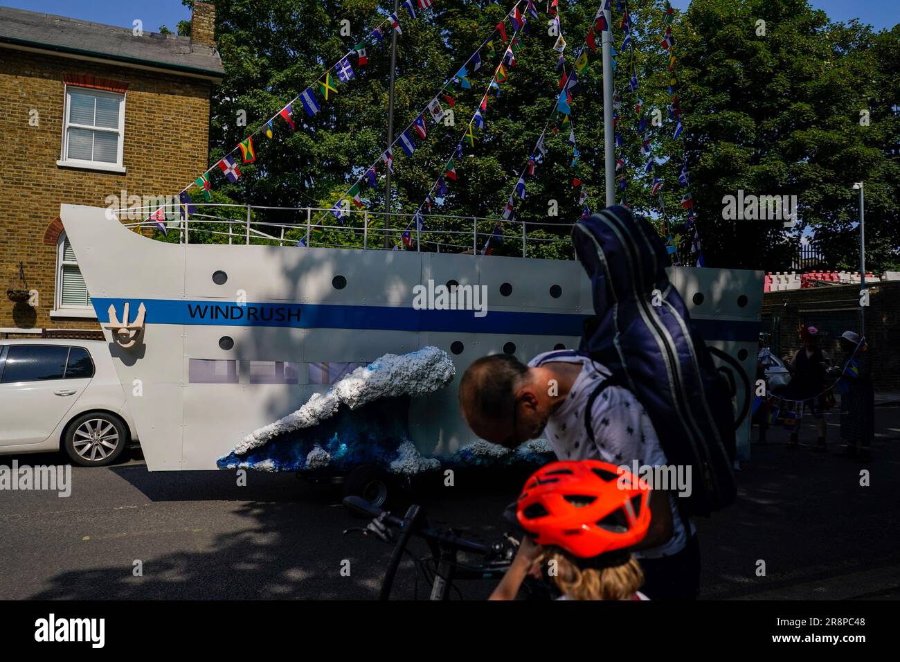 A makeshift Windrush ship leads the procession that commemorates the ...