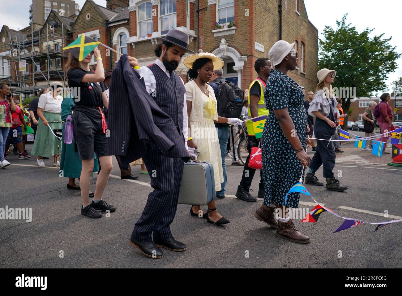 People take part in the procession that commemorates Windrush Day in ...
