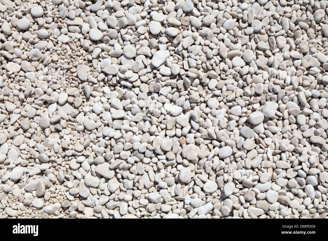 White stone beach background in Sardinia island, Italy. White zen stone ...