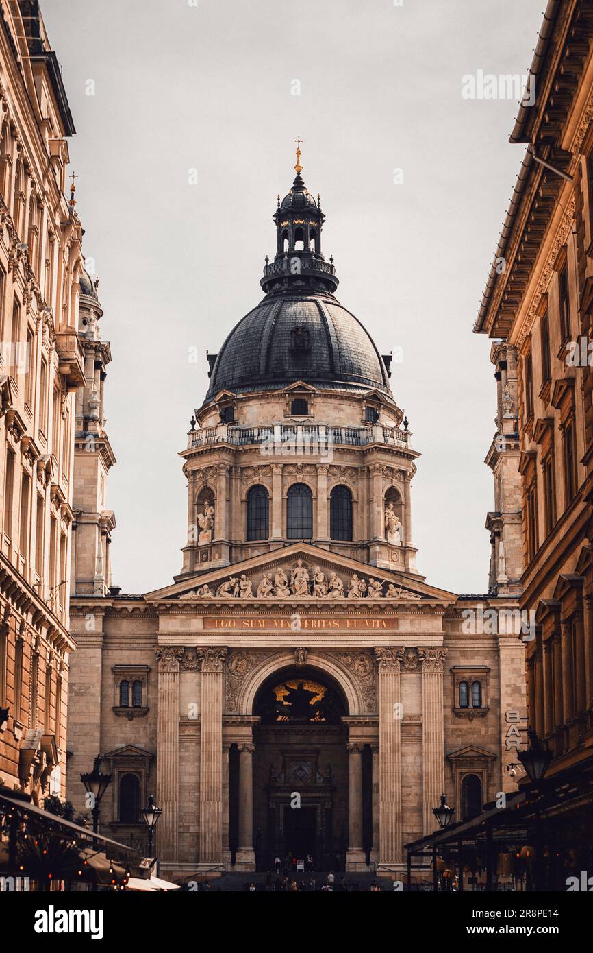 An aged structure with multiple arches in the foreground, offering a ...