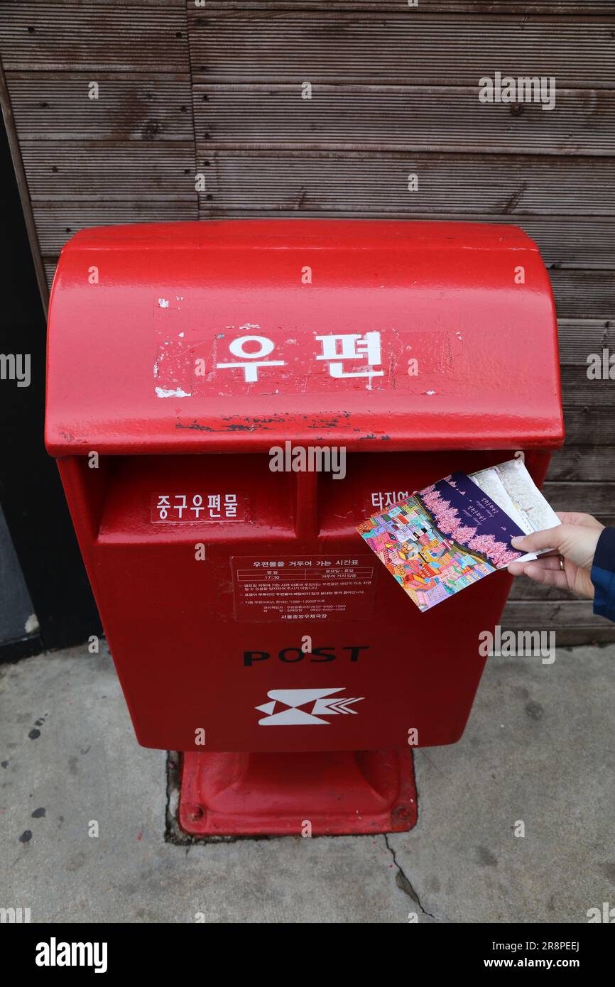 SEOUL, SOUTH KOREA - APRIL 7, 2023: Person mailing postcards in public ...