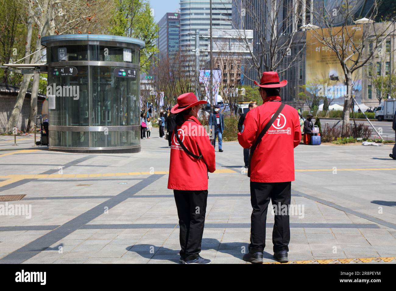 SEOUL, SOUTH KOREA - APRIL 9, 2023: Tourist information workers helping ...