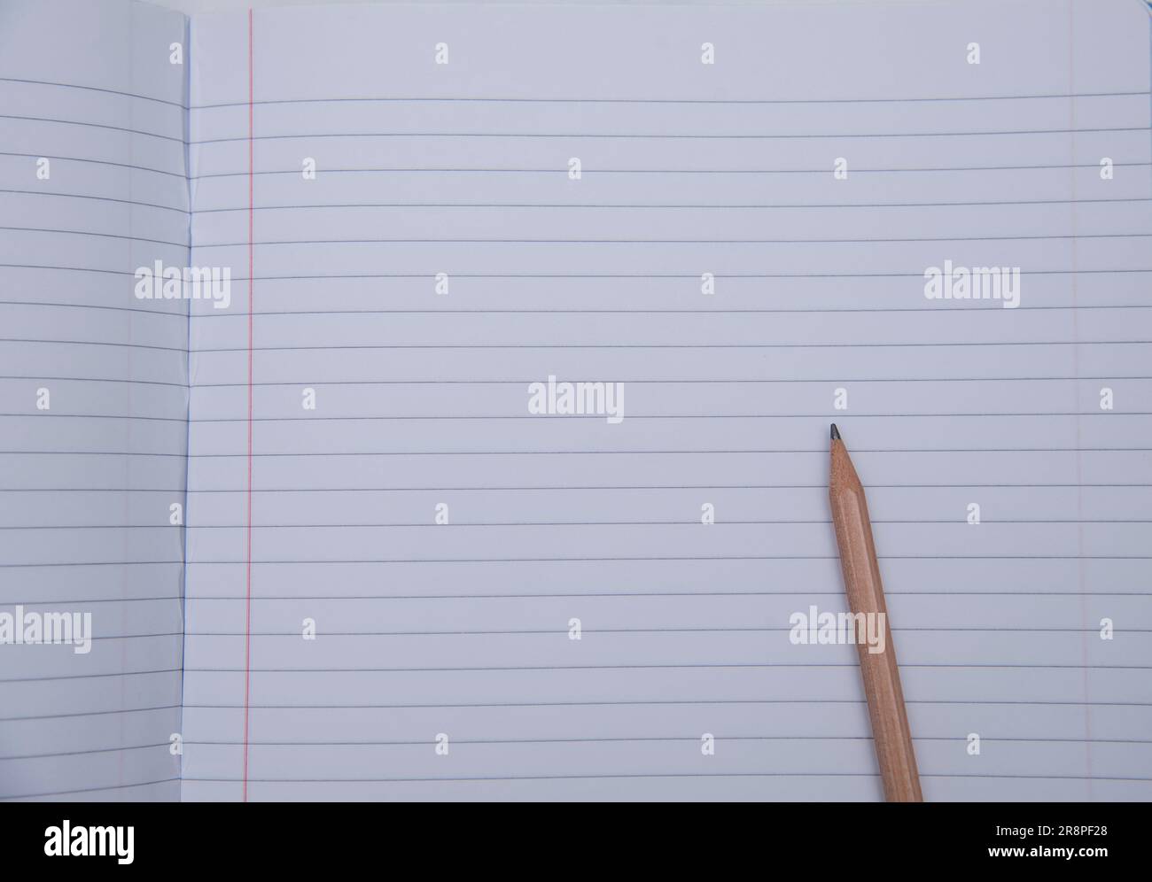 Pencil on a notebook in a rules. back to school concept Stock Photo - Alamy