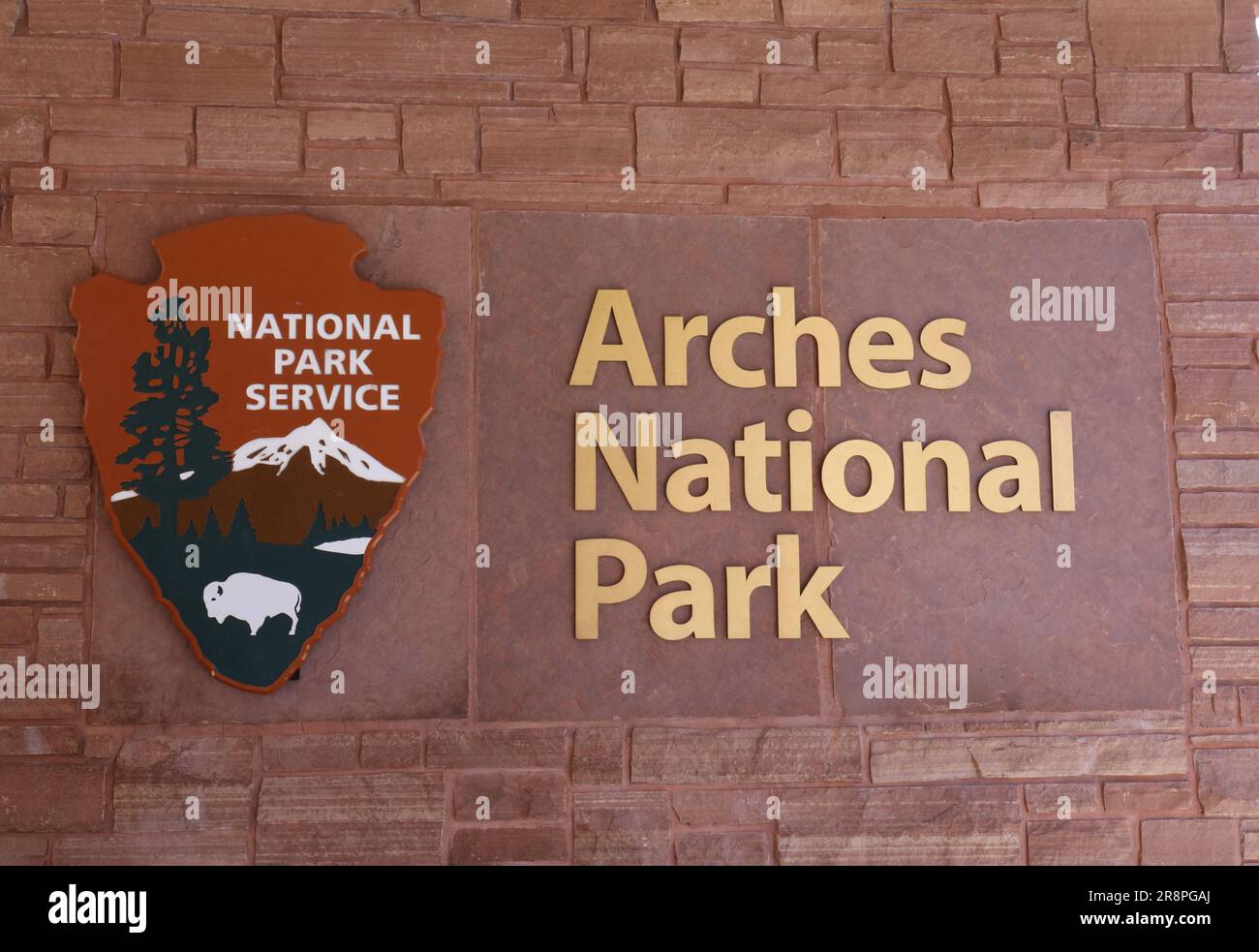 Arches National Park and National Park Service signs on the sandstone ...