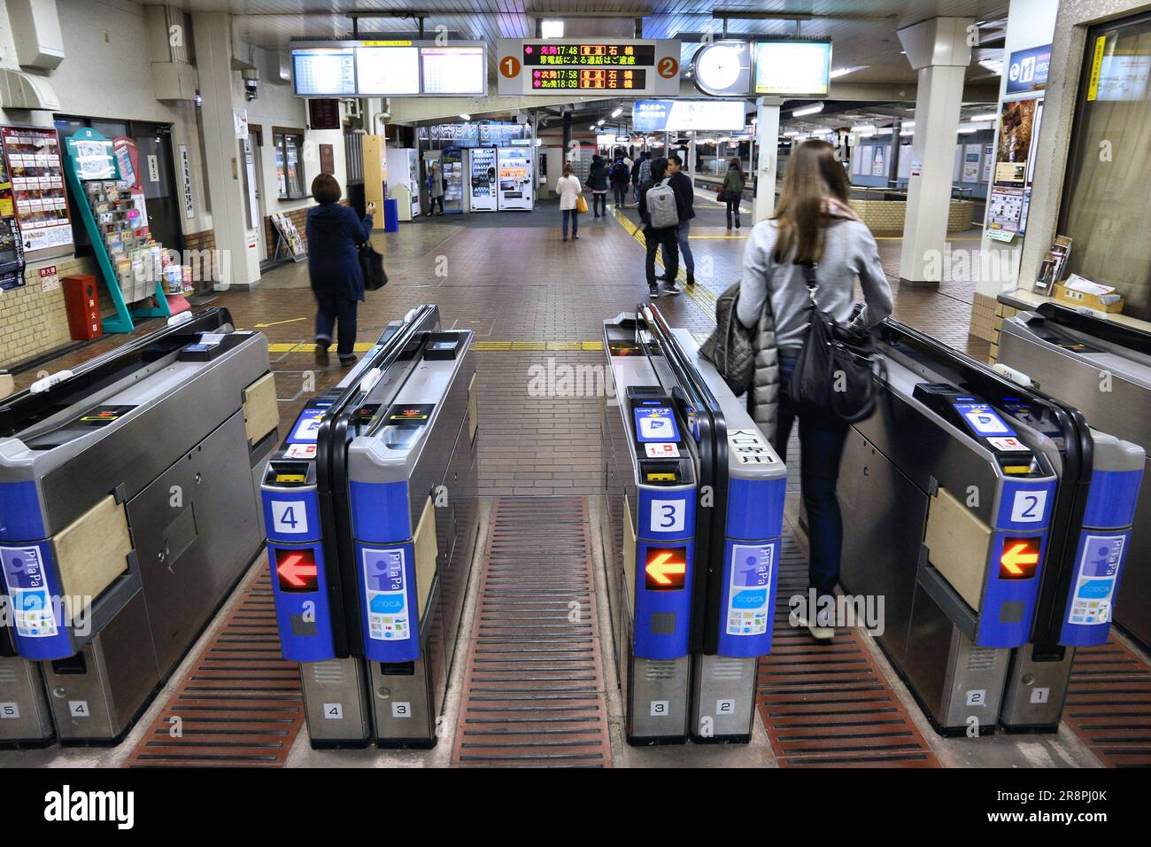 MINOH, JAPAN - NOVEMBER 22, 2016: Passengers enter through automated ...