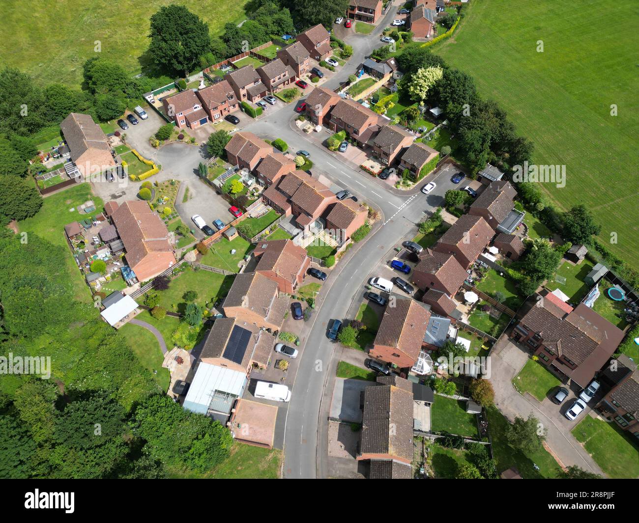 Aerial view of modern houses in a cul de sac surrounded by parkland in ...