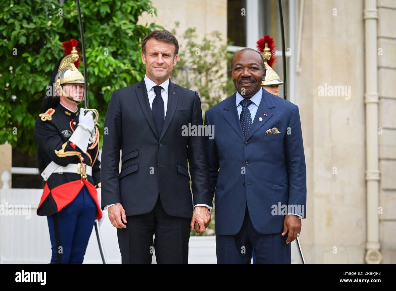 Paris, France. 22nd June, 2023. French President Emmanuel Macron greets ...