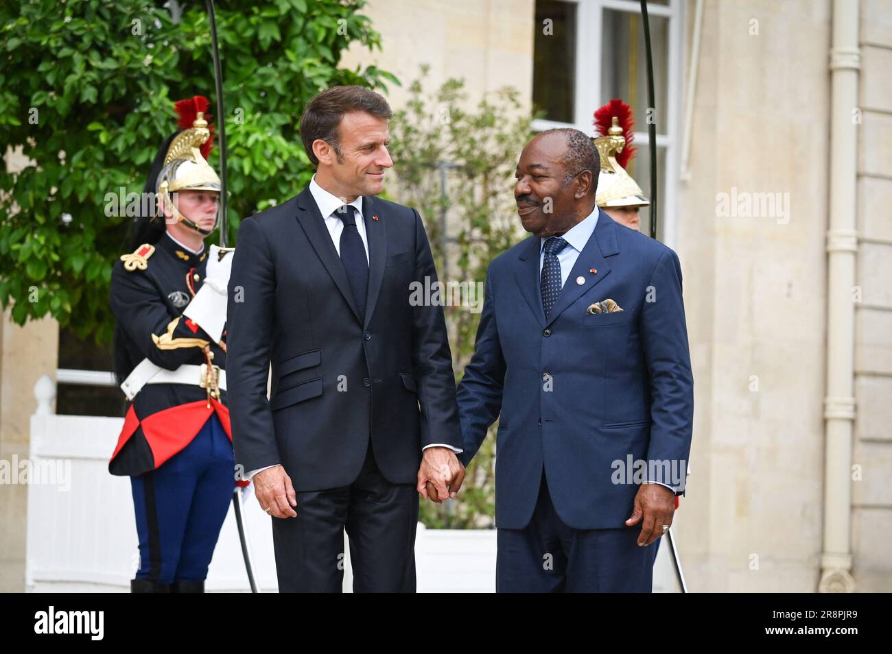 Paris, France. 22nd June, 2023. French President Emmanuel Macron greets ...